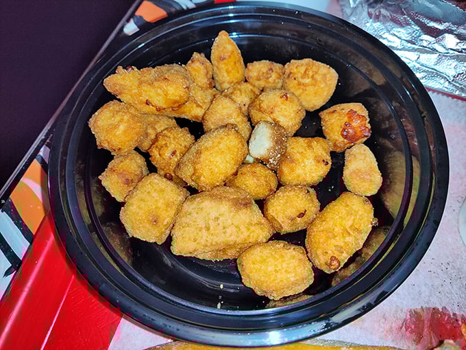 Cheese bites: where breading meets melty goodness in a relationship more satisfying than most reality TV romances.