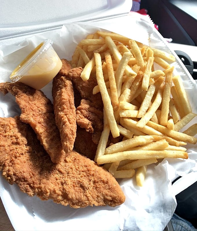 Crispy chicken fingers and fries—comfort food that speaks the universal language of "yes, this is exactly what I needed today."