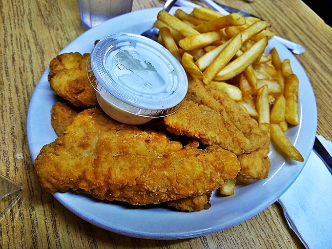 Crispy on the outside, juicy within—these chicken strips and fries are what fast food chains have been trying to replicate for decades.