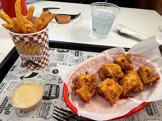 Crispy nuggets and golden fries—comfort food that transports you back to childhood, just with better taste and an adult beverage.