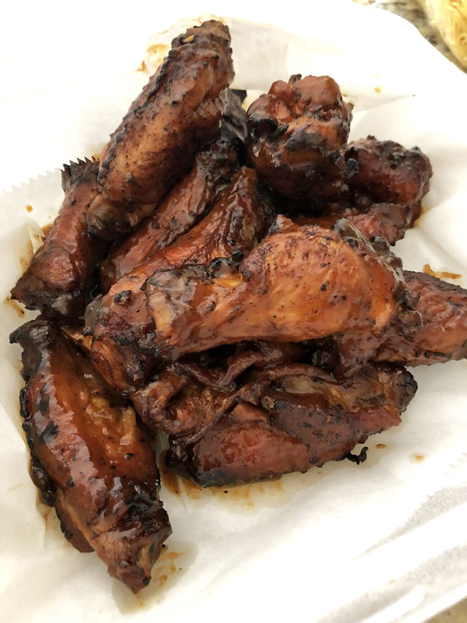 These wings aren't trying to be anything but their best selves – deeply smoked, perfectly sauced, and ready for their close-up.
