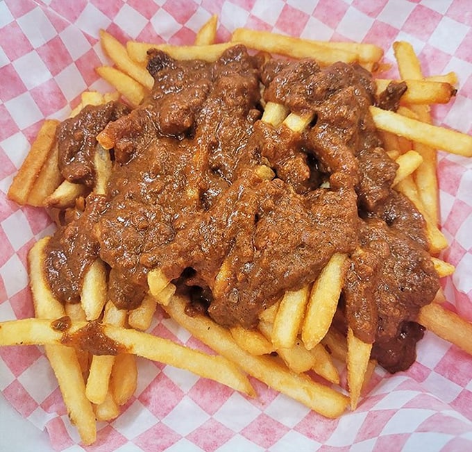 Chili cheese fries that laugh in the face of diet plans. A glorious mess that requires both fork and commitment—worth every napkin.