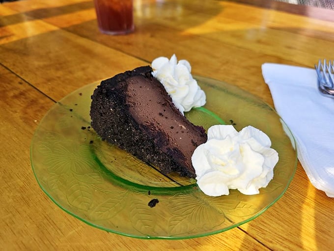 This chocolate cheesecake with twin dollops of whipped cream isn't just dessert—it's the reason elastic-waist pants were invented.
