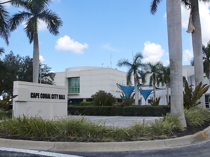 City Hall stands as a modern beacon in a sea of palm trees. Local government with a view beats fluorescent-lit basement offices any day.
