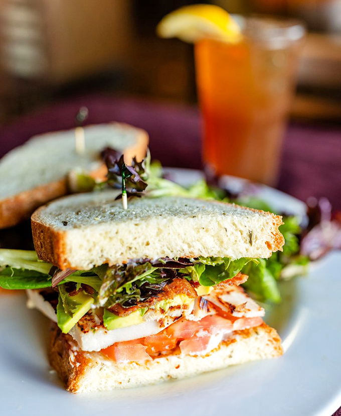 This sandwich isn't just stacked—it's engineered for maximum flavor transfer, with fresh greens providing the perfect crunch counterpoint.