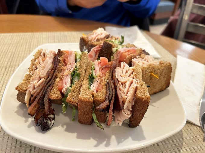 This club sandwich isn't just stacked—it's architected. Three stories of deliciousness that makes lunch feel like the main event.