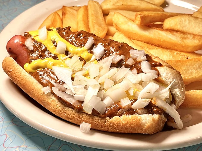 A proper Coney dog loaded with the works—proof that sometimes the messiest foods create the cleanest joy.