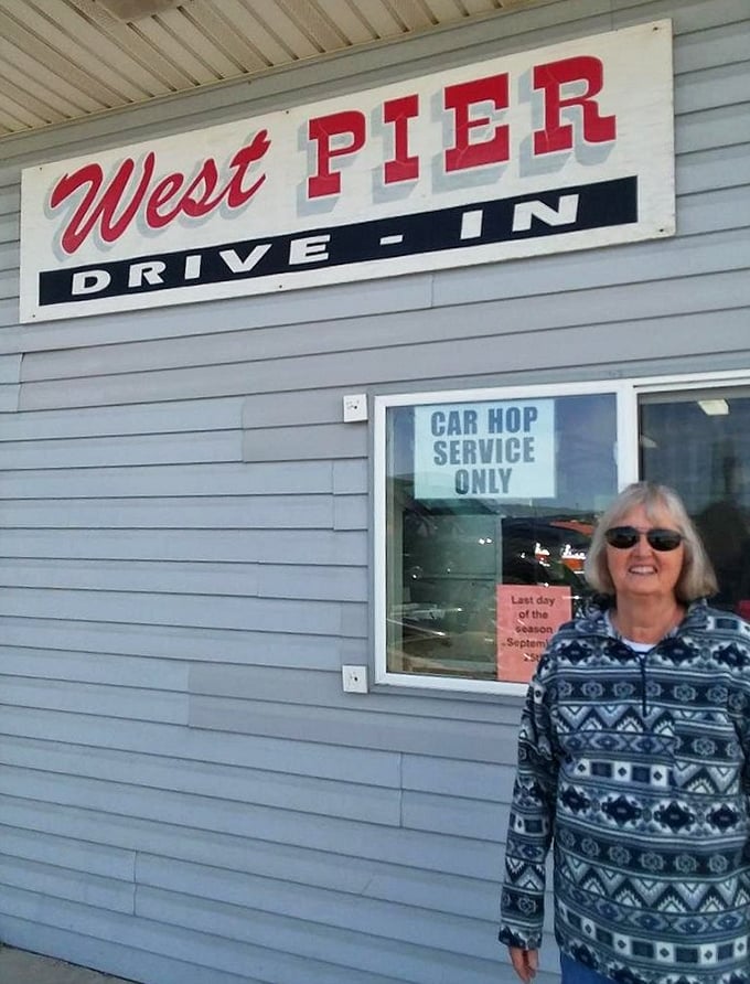The drive-in's sign promises "Car Hop Service Only"—a delightful throwback to simpler times when good food came with a side of nostalgia.