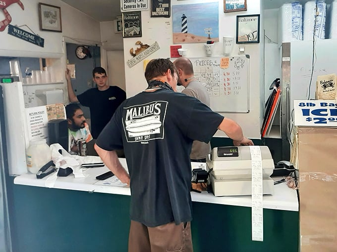 The sacred transaction: seafood changing hands at the counter. This moment of anticipation is almost as good as the first bite. Almost.