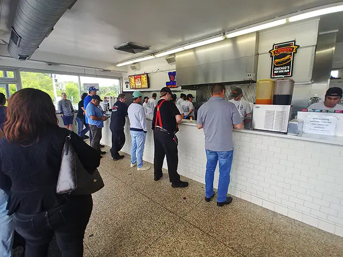 The great equalizer: everyone becomes family when waiting for hot dog nirvana.