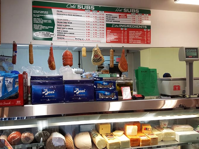 The deli counter—where decisions are made, friendships are formed, and the staff knows exactly how thin to slice that prosciutto.
