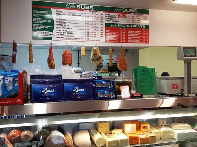 The deli counter—where decisions are made, friendships are formed, and the staff knows exactly how thin to slice that prosciutto.