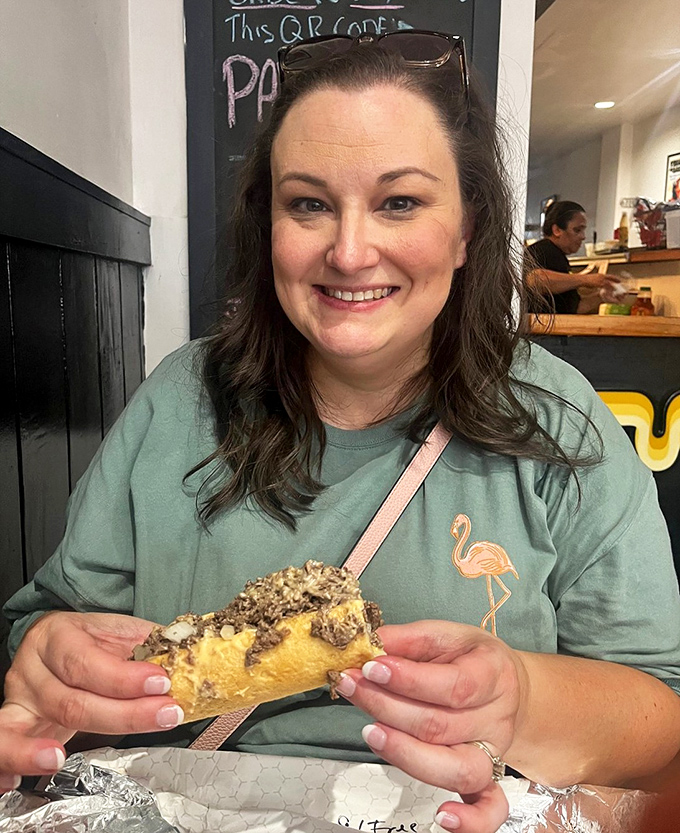 The joy of biting into a Woodrow's sandwich is universal—just look at that face of pure sandwich satisfaction.