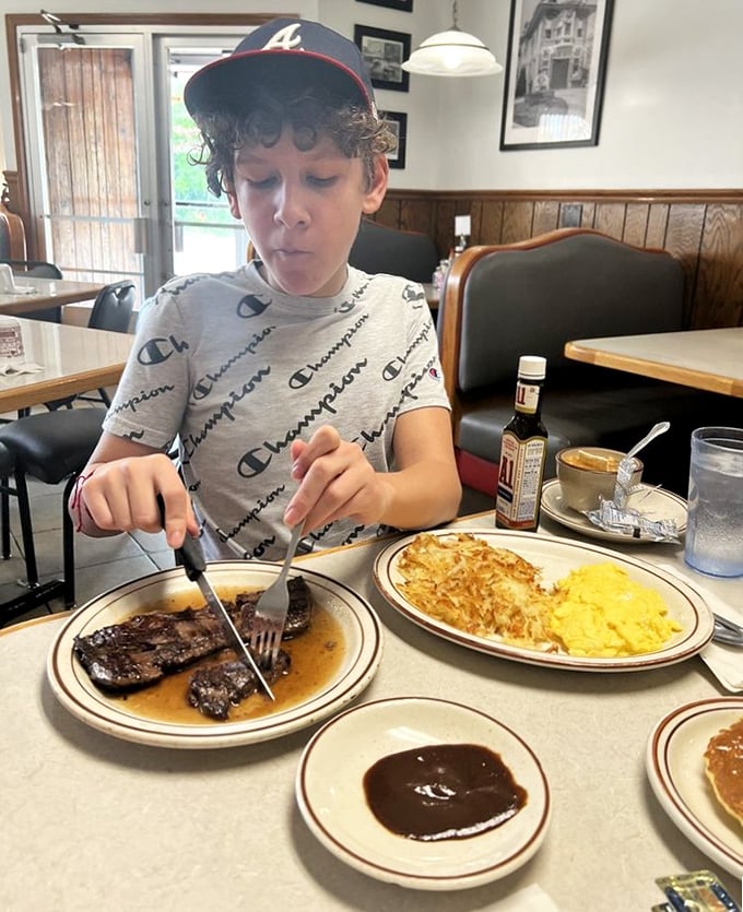 Watching a young diner tackle steak and eggs with the concentration of a neurosurgeon—childhood breakfast memories in the making.