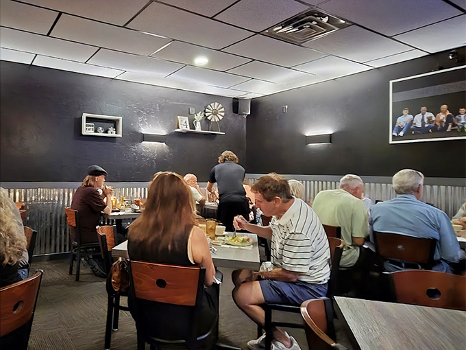 Happy diners share the universal language of satisfied smiles that only exceptional comfort food can truly inspire.