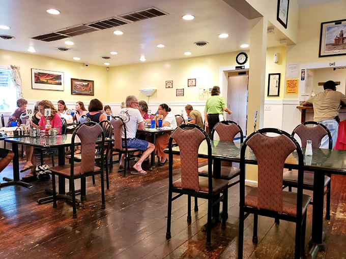 The dining room hums with conversation and the clinking of forks against plates—the soundtrack of a community gathering place.