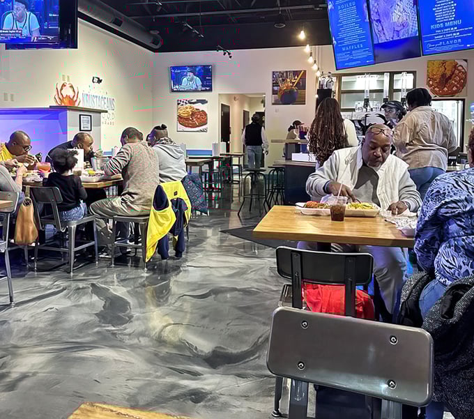 The universal language of seafood brings diners together, hands busy with crab crackers, conversation flowing as freely as the seasoned butter.