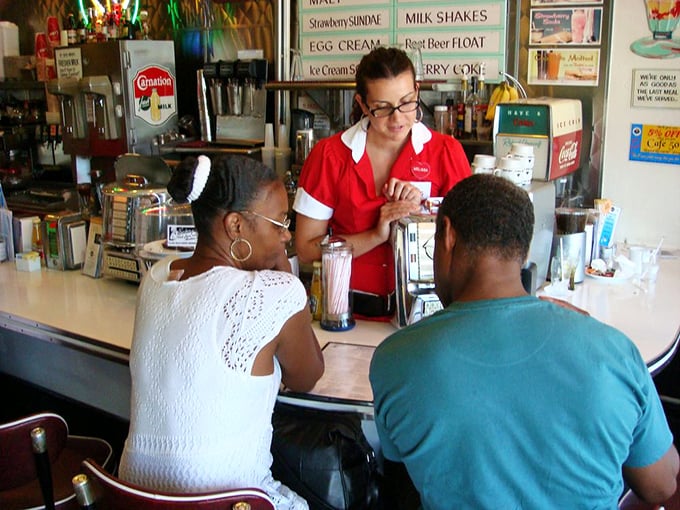 The counter isn't just where orders happen—it's where strangers become neighbors and servers become temporary therapists over coffee and conversation.
