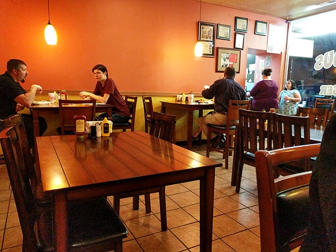 The dining room – where strangers become united in the universal language of "mmm" and "wow." Notice how nobody's looking at their phones? That's the power of great food.