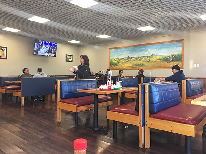 The true measure of a great taqueria isn't just the food—it's the diverse crowd of regulars who've made these blue booths their second dining room.
