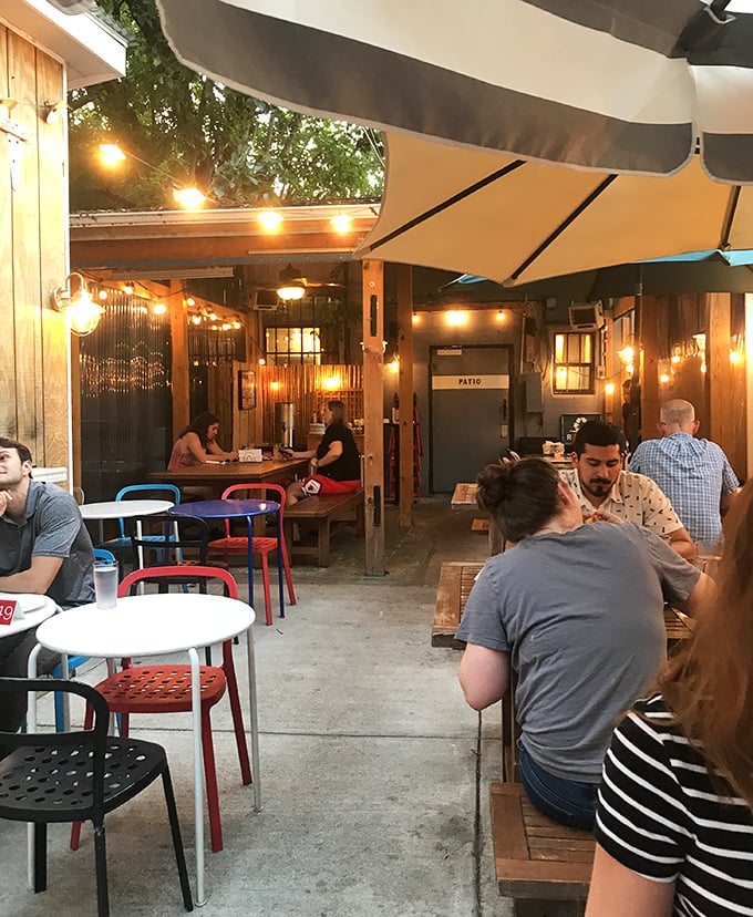 The patio at dusk—where string lights, good company, and the promise of pizza create that perfect "life is good" moment. 