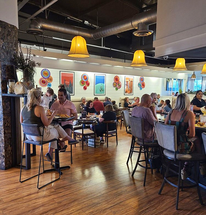 The dining room buzzes with the universal language of good food, where strangers become neighbors united by their love of authentic flavors.