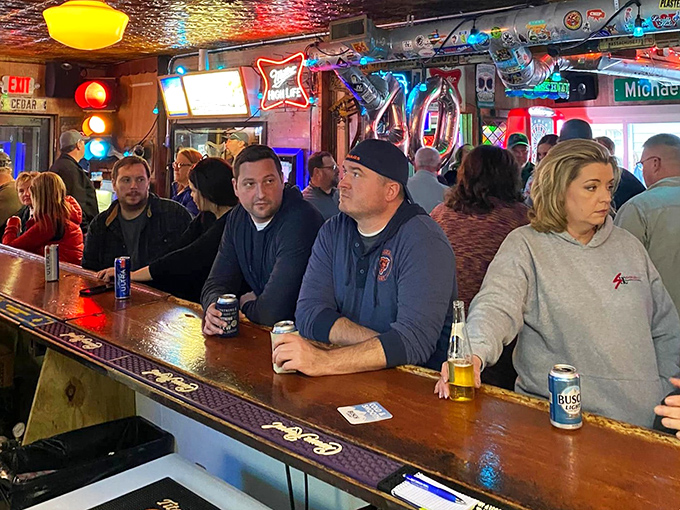 The bar on a busy night—where strangers become neighbors and neighbors become friends. Cold beer and warm conversation flow with equal abundance.