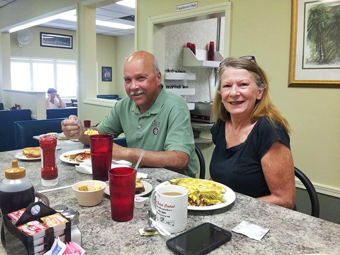 Happy diners with red cups and satisfied smiles—the universal language of "you need to try this place."