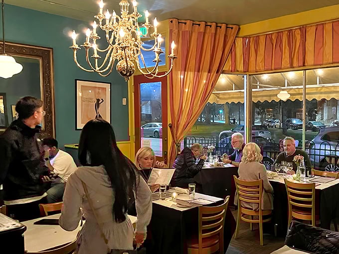The dining room glows with conversation and candlelight. Even the chandelier seems to be eavesdropping on tales of delicious discoveries.