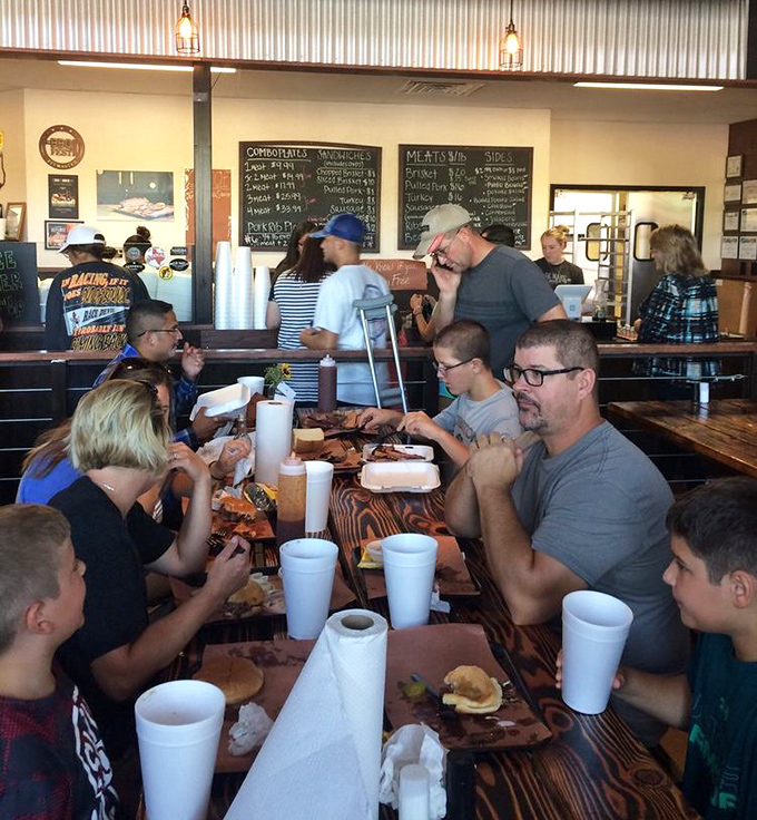 The communal tables at Evie Mae's turn strangers into friends, united by the universal language of "pass the sauce" and appreciative food groans.