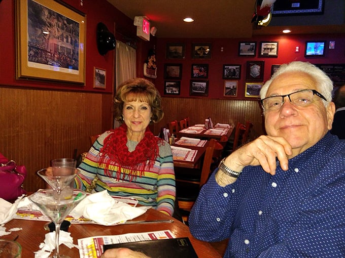 The best restaurants create memories as much as meals. These diners aren't just eating dinner—they're collecting moments in Station 43's warm, wood-paneled embrace.