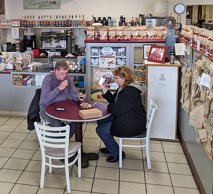The universal language of pastry appreciation. These diners understand that some pleasures require no explanation, just enjoyment.