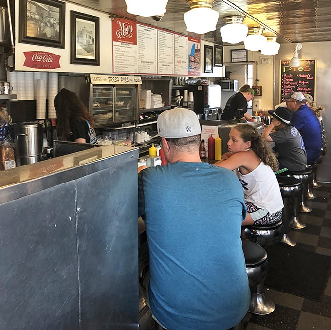 The counter at Town Topic—where strangers become friends united by the universal language of "pass the ketchup" and appreciative burger mumbles.