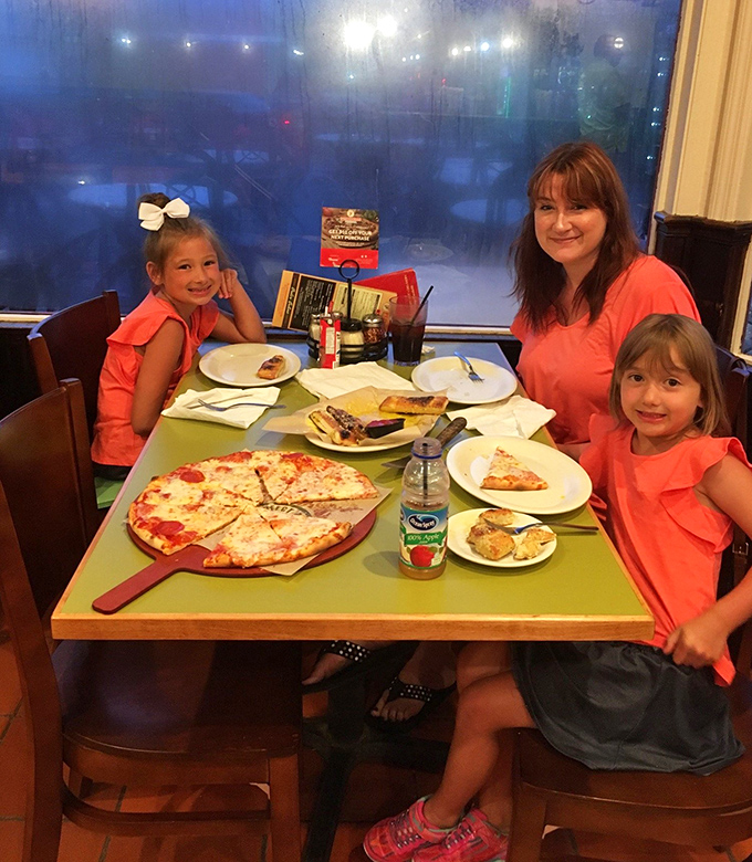 Family moments around a Flippers table—where memories are made one slice at a time.