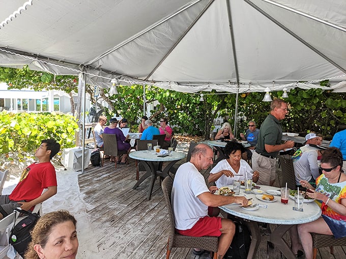 Dining under a tent with your toes in the sand isn't just eating—it's therapy that happens to come with excellent seafood.
