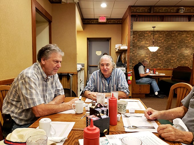 The regulars' table, where coffee flows freely and conversations meander from weather to grandkids to the eternal debate: pie or cake?