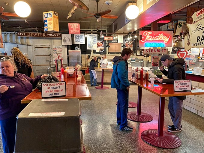 The standing tables at Faidley's—where strangers become friends united by the universal language of "mmmmm" and "you've got to try this."