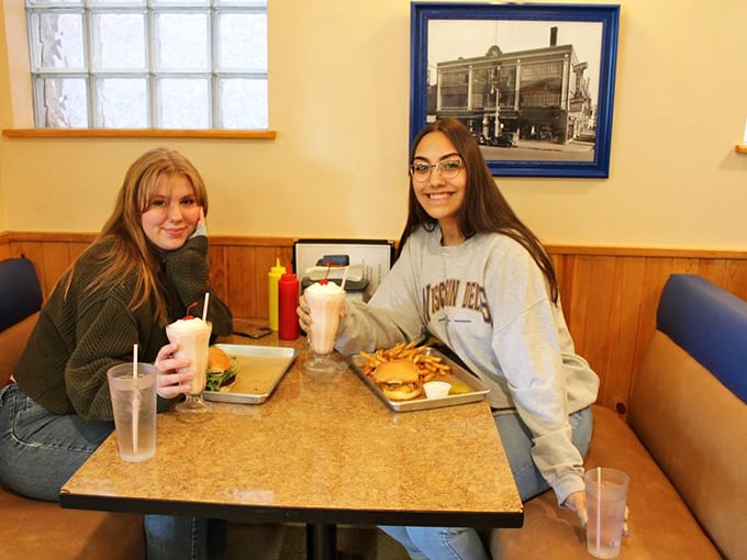 Al's isn't just about food; it's about creating memories. These diners know that some conversations just taste better when accompanied by milkshakes and burgers.