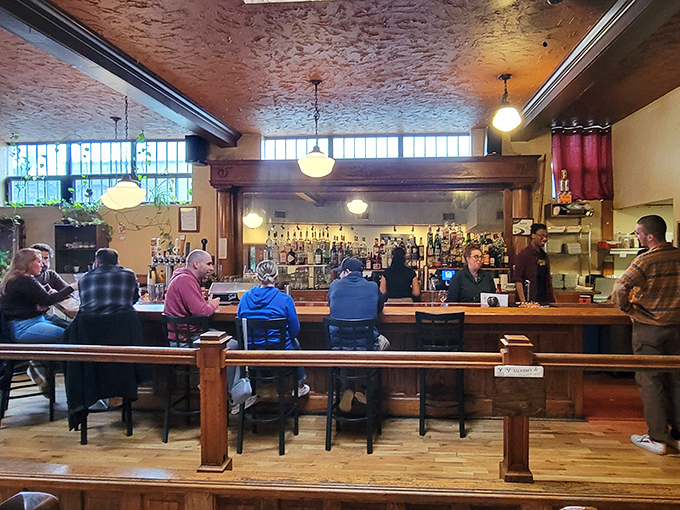 The bar at Alchemy isn't just where drinks are served—it's where strangers become friends and friends become family over craft beers.