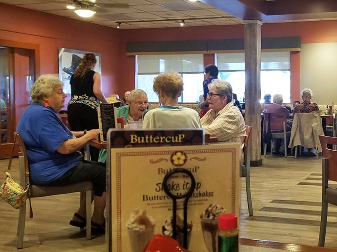 Regulars gather around tables, menus in hand, proving that Buttercup isn't just a place to eat—it's where community happens.