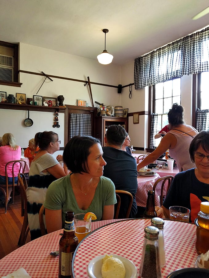 Happy diners enjoying their meals in this cozy atmosphere where every table feels like the best seat in class.