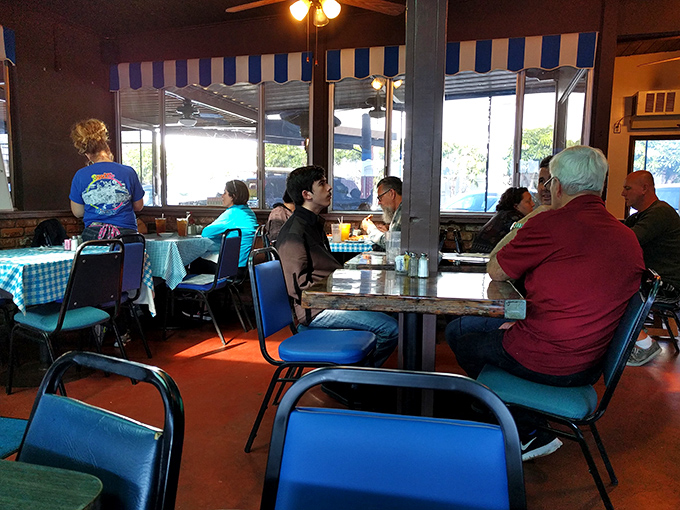 The true heart of any great diner: its patrons. Blue chairs, checkered tablecloths, and conversations that have been flowing for decades.