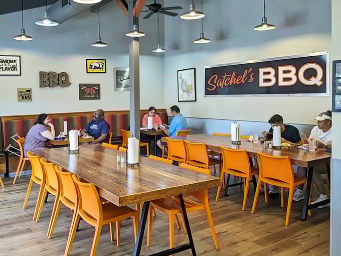 The universal language of barbecue brings strangers together at communal tables. Notice the absence of conversation—everyone's too busy eating.