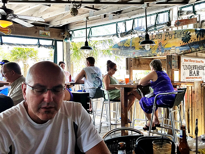 The "Underwhere Bar" – where locals and tourists alike find common ground in cold drinks and Gulf breezes.