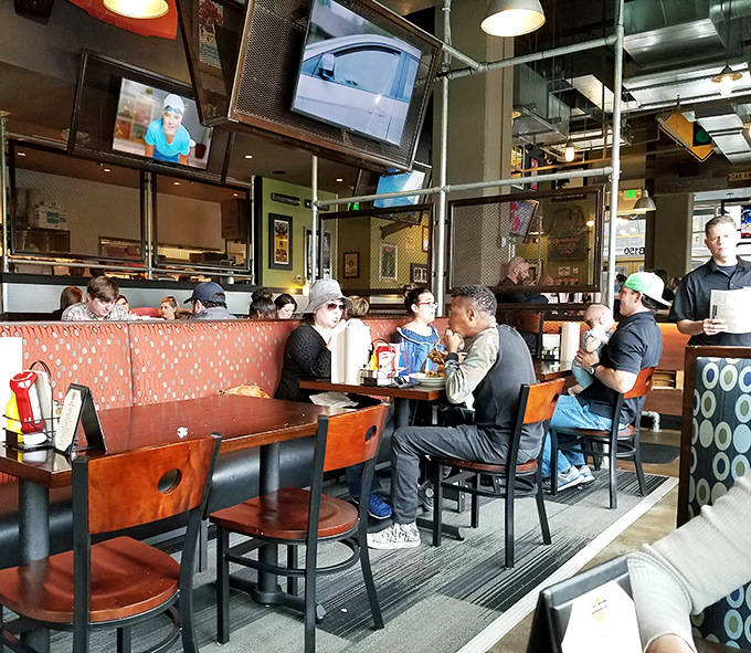 The dining room buzzes with the universal language of burger appreciation—where strangers become united in the pursuit of deliciousness.