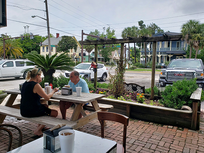 The outdoor seating area—where strangers become friends and friends become family, all united by the universal language of great food.