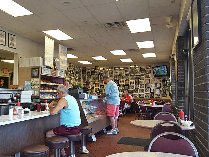 The counter seating—where solo diners become regulars and regulars become family. Notice the worn spots on those stools? Badges of delicious honor.