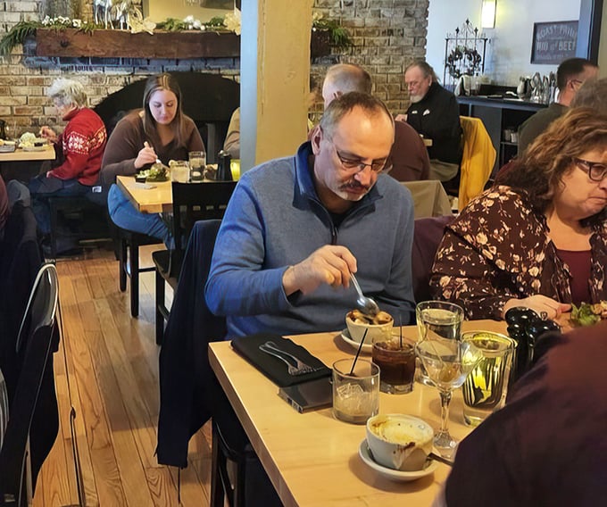 The dining room hums with the universal language of satisfaction – forks pausing mid-air as conversations flow between bites.