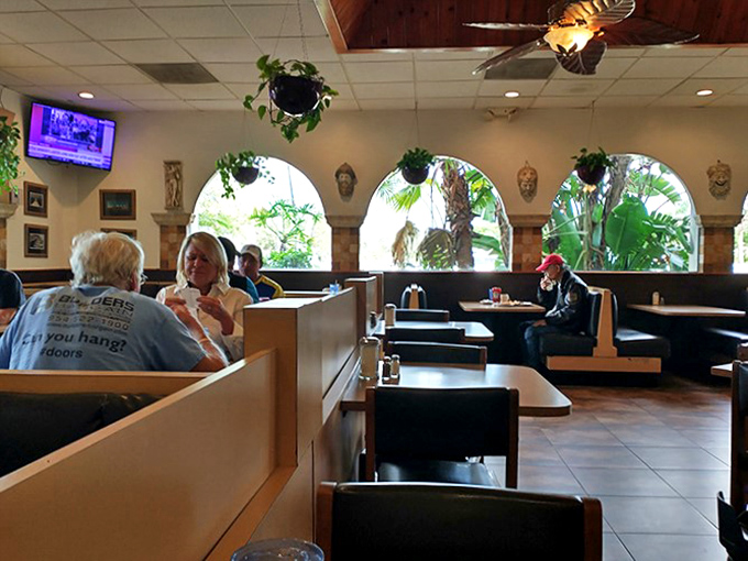 Where strangers become neighbors and neighbors become family. The arched windows frame Florida palms like living paintings.