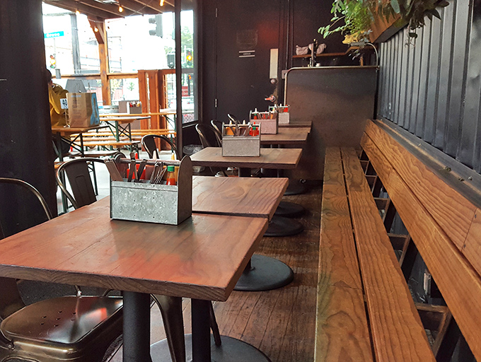 Simple wooden tables and industrial chairs say, "We spent our money on the smoker, not the furniture." Priorities in perfect order.